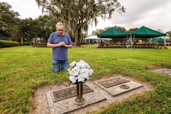 Deacon Torres at the grave of his wife | Calvary Catholic Cemetery